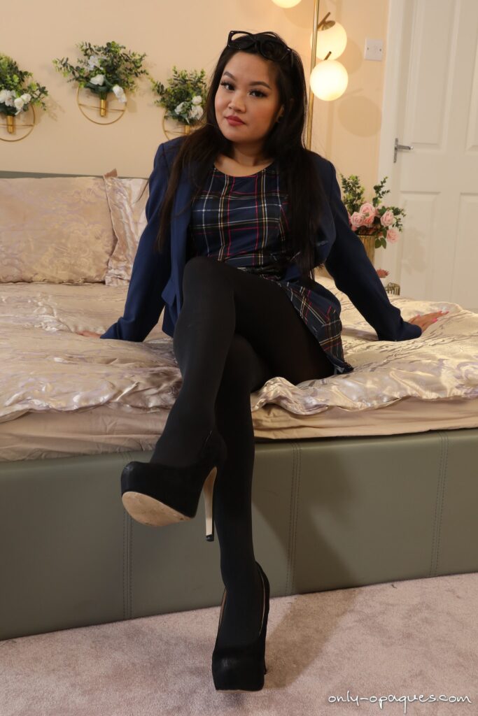 Only-Opaques Louisa Lu in a plaid minidress and opaque pantyhose